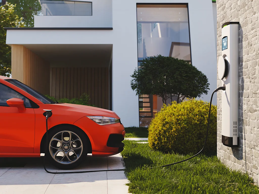 What is V2G technology and how does it affect EV adoption?